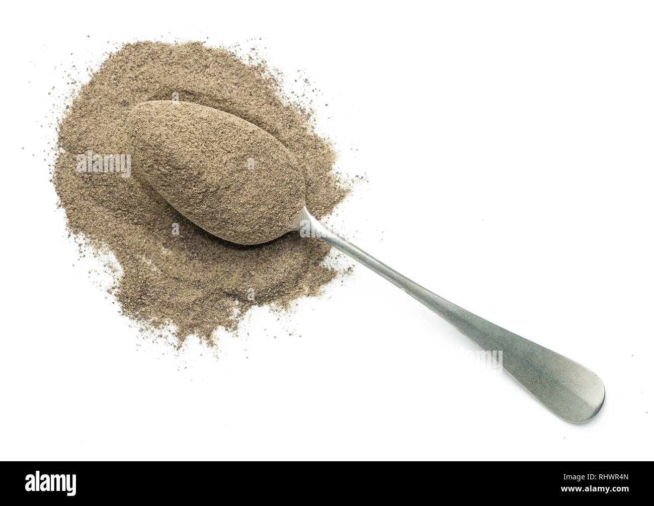 Black pepper powder on silver spoon isolated on white background. Top ...