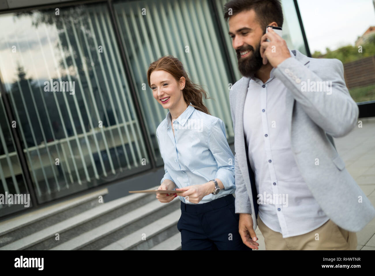 Business people walking and talking outdoor Stock Photo - Alamy