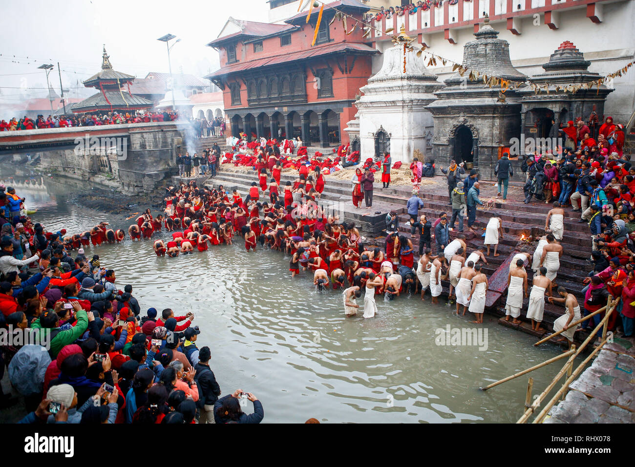 Kathmandu, Nepal. 04th Feb, 2019. Devotees offer prayer before taking ...