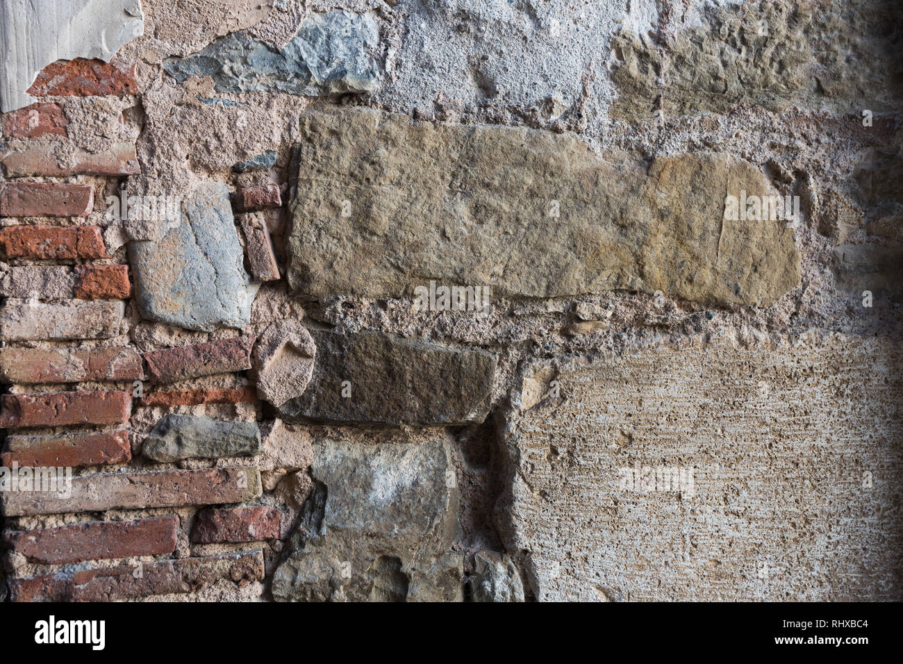Old damaged stone wall surface texture Stock Photo - Alamy