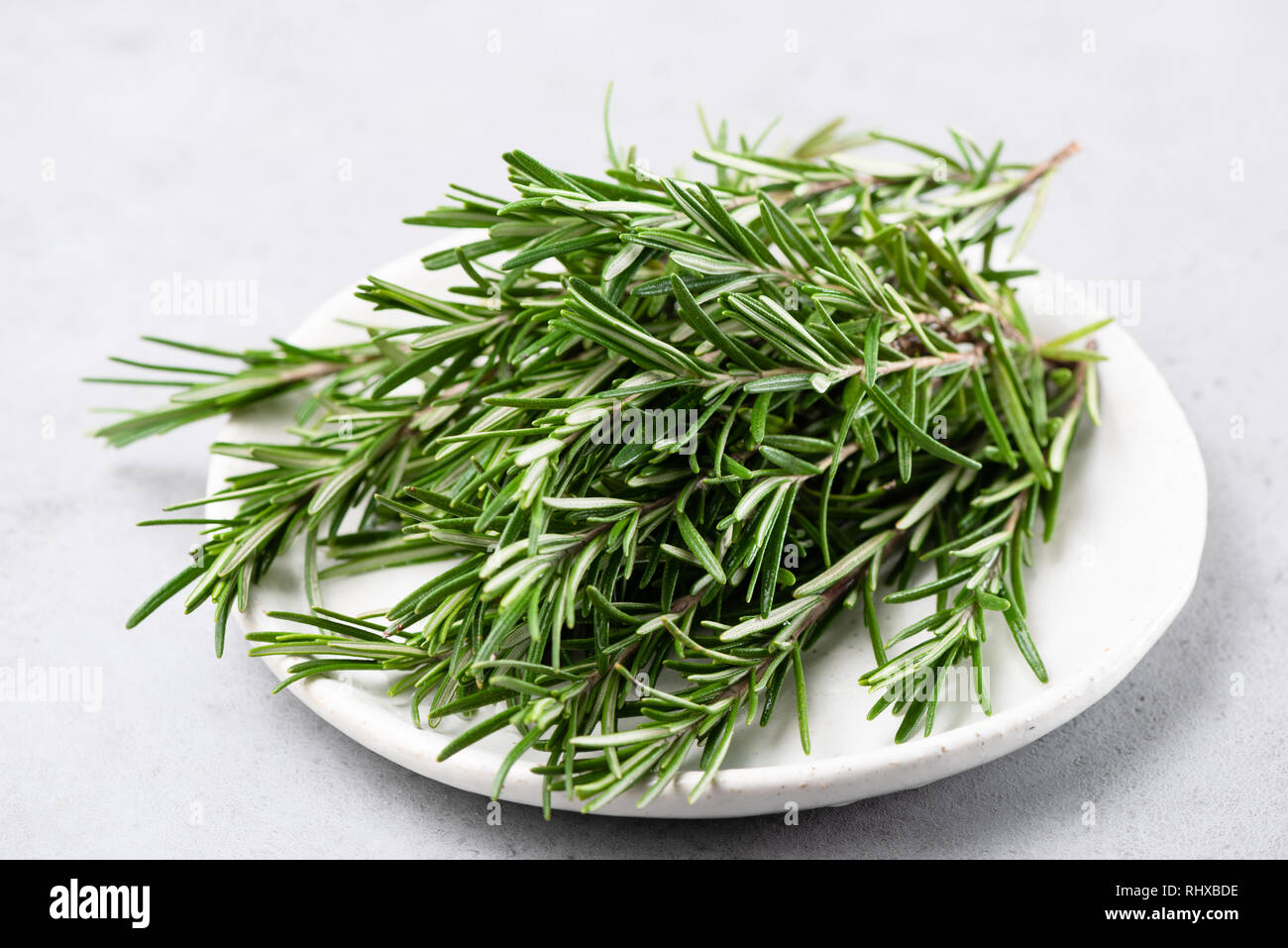 Fresh rosemary herbs closeup view. Isolated on white background Stock ...