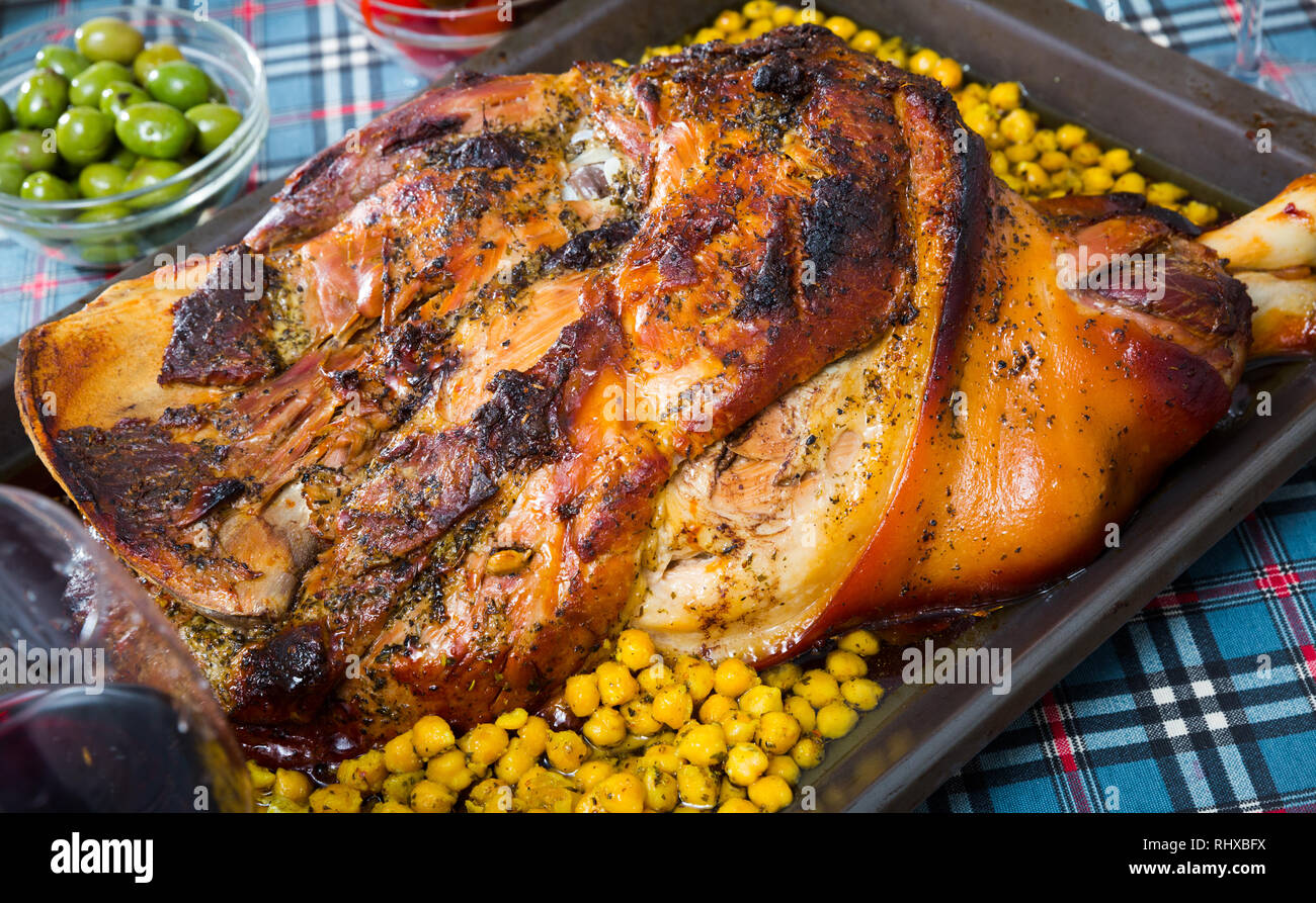 Image of tasty baked in oven pig ham with garbanzo at plate Stock Photo ...