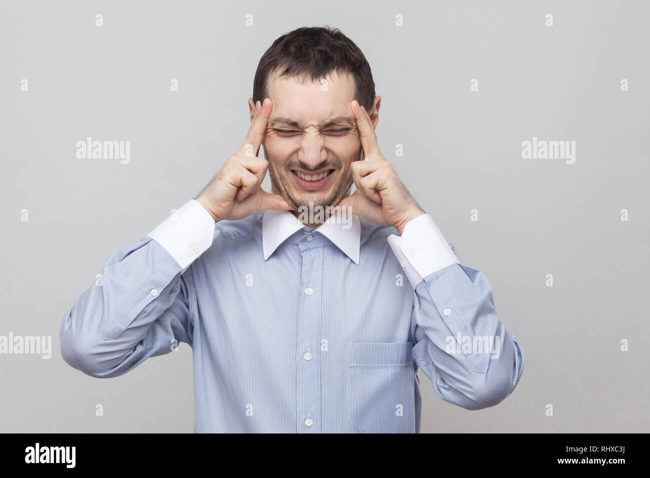 headache pain. Portrait of angry bristle businessman in classic blue ...