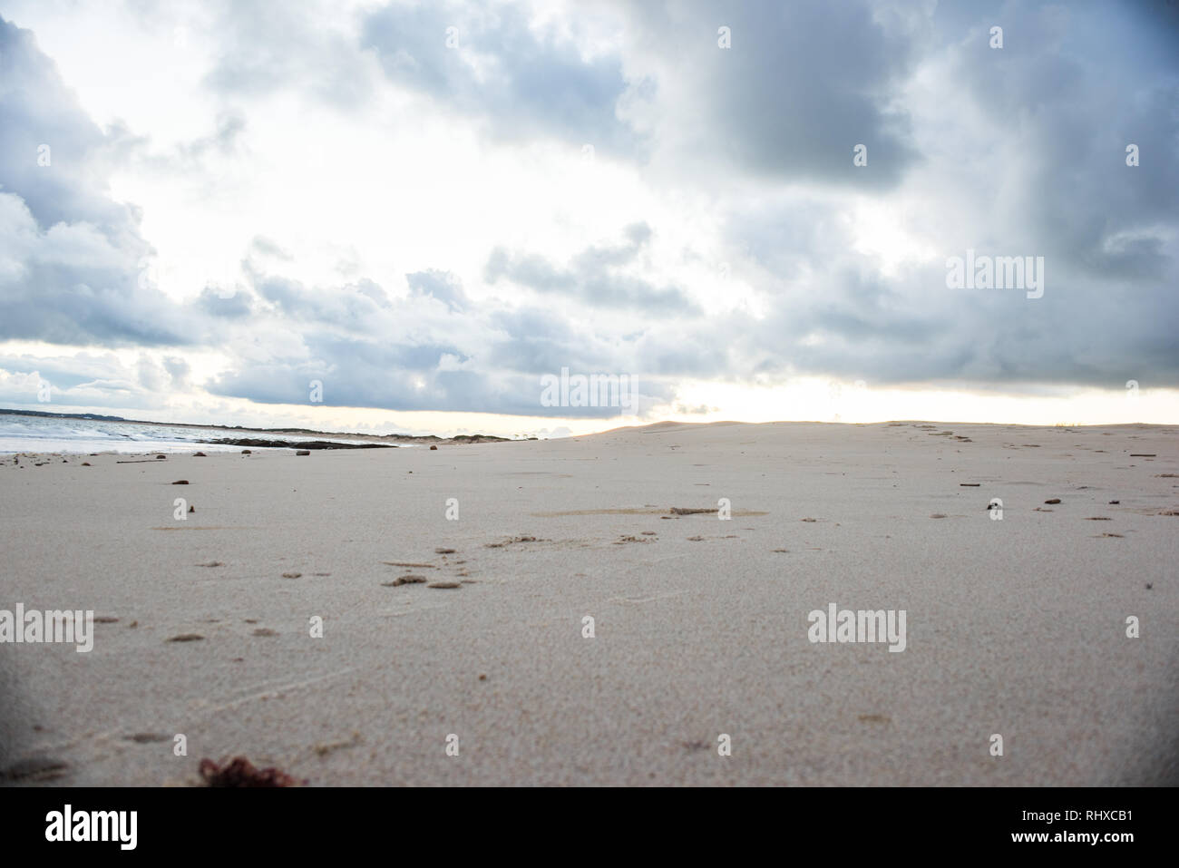 cloudy empty beach with footprints in uruguay Stock Photo - Alamy