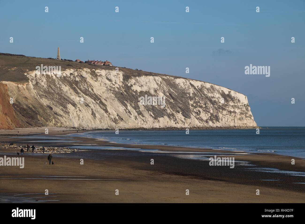 white cliffs, beach and sea with incidental walkers Stock Photo - Alamy
