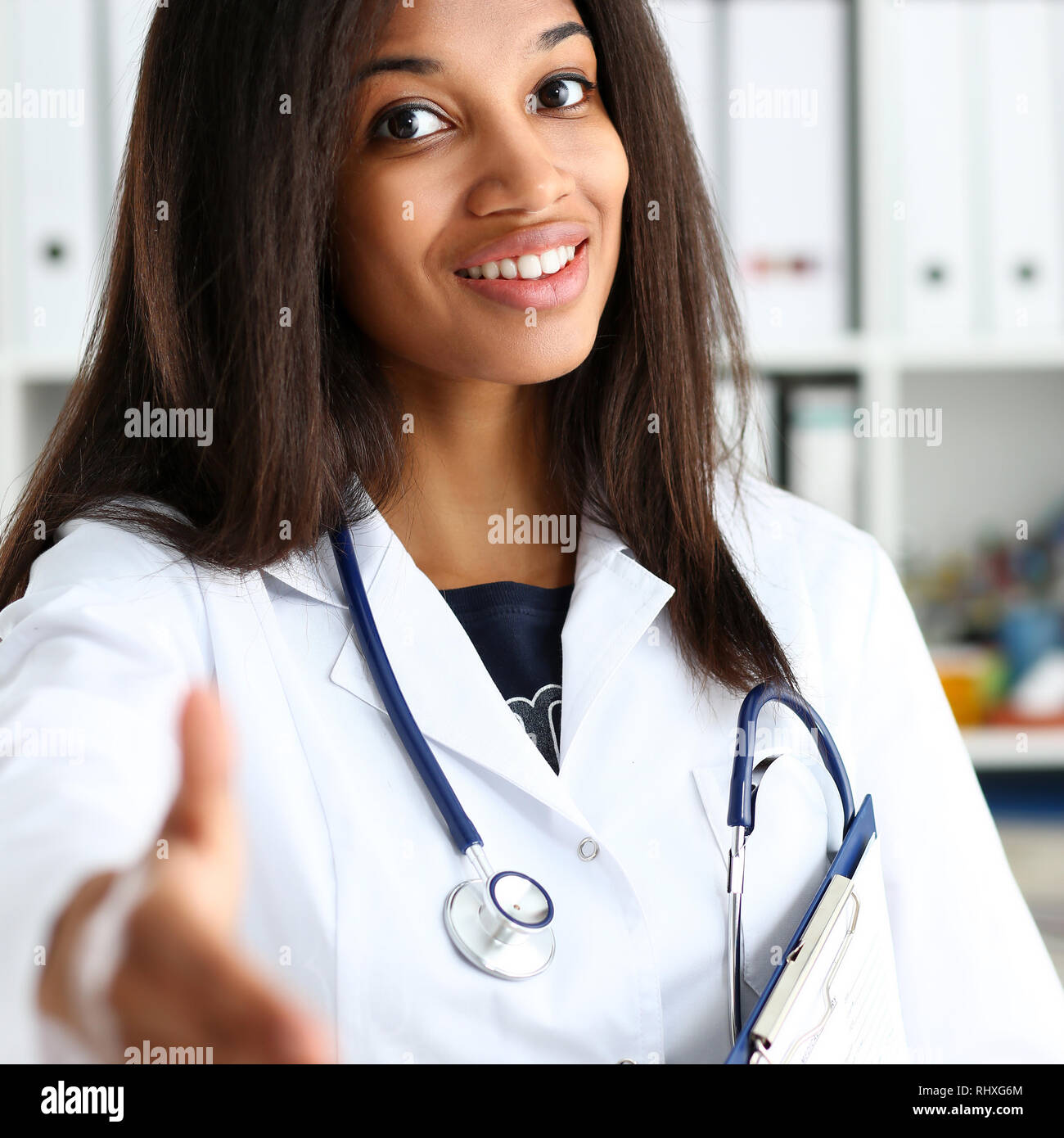 Doctor shake hand as hello with patient Stock Photo - Alamy