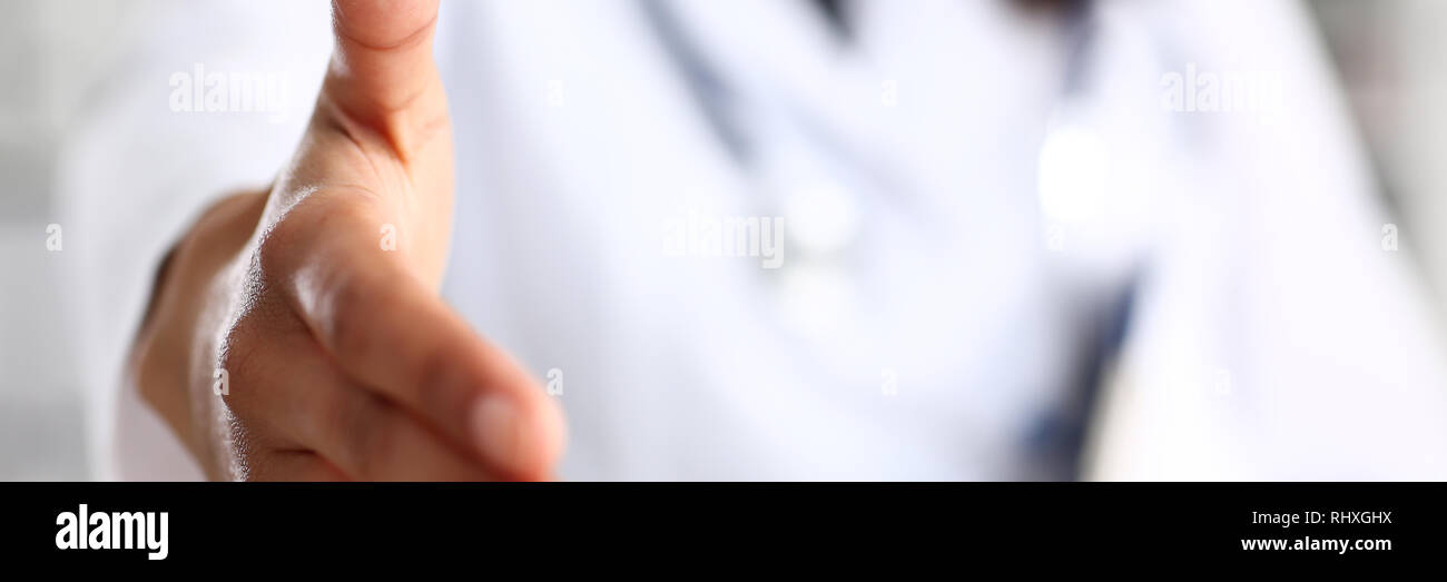 Doctor shake hand as hello with patient Stock Photo - Alamy