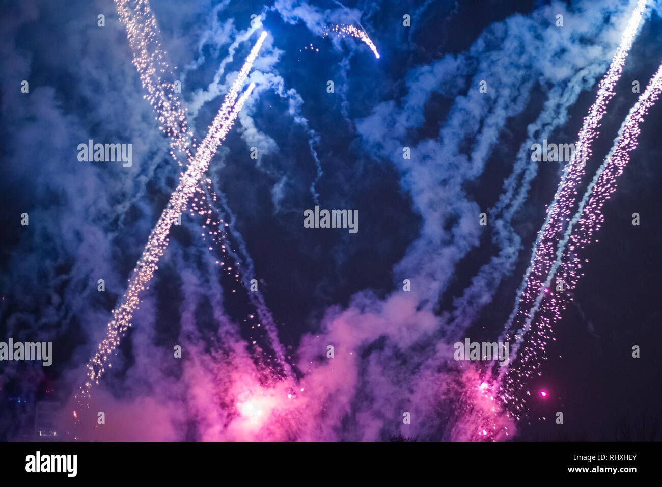 Explosive and colorful holiday fireworks at night sky. Celebration City ...