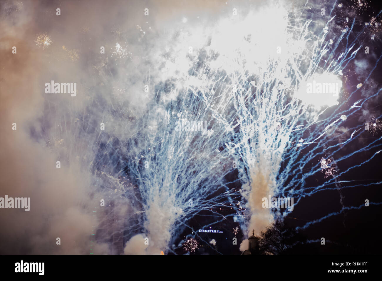 Explosive and colorful holiday fireworks at night sky. Celebration City ...