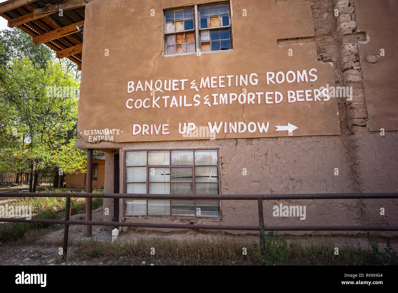 Old hand painted signs advertising Cocktails and Imported Beers and a ...
