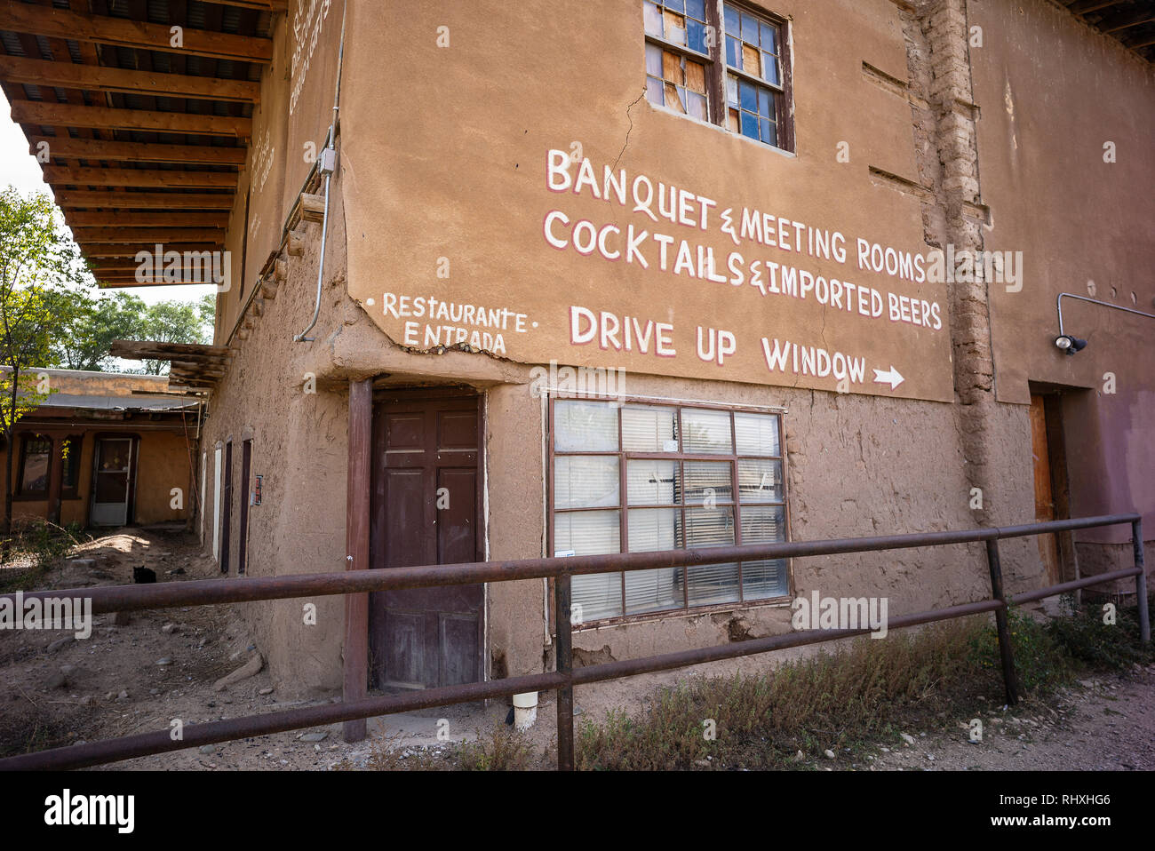 Old hand painted signs advertising Cocktails and Imported Beers and a ...