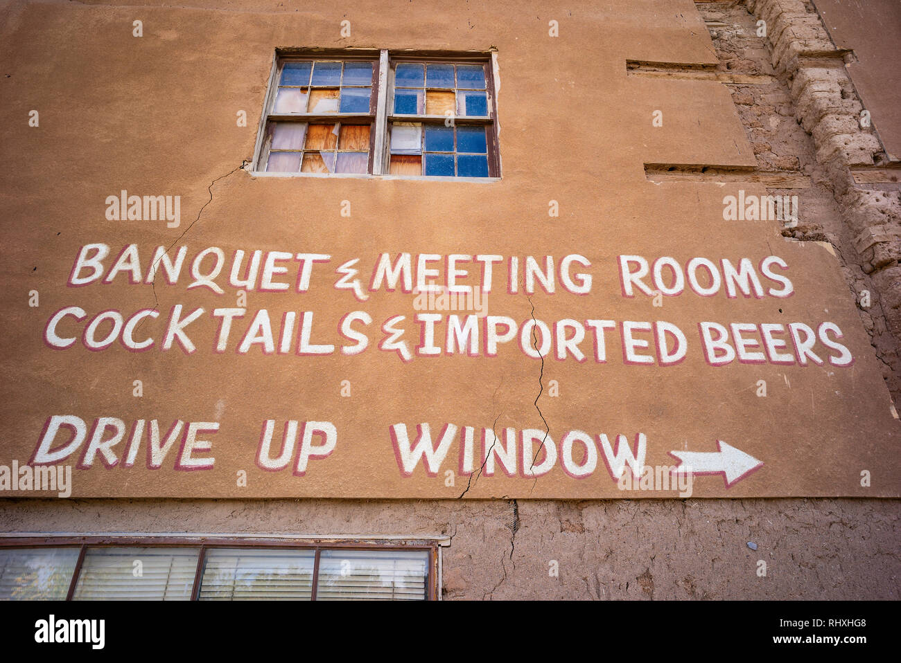 Old hand painted signs advertising Cocktails and Imported Beers and a ...