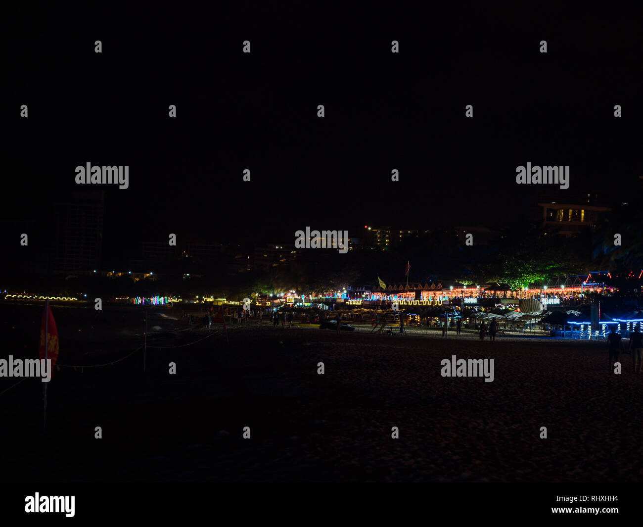 Night beach with cafe Stock Photo - Alamy