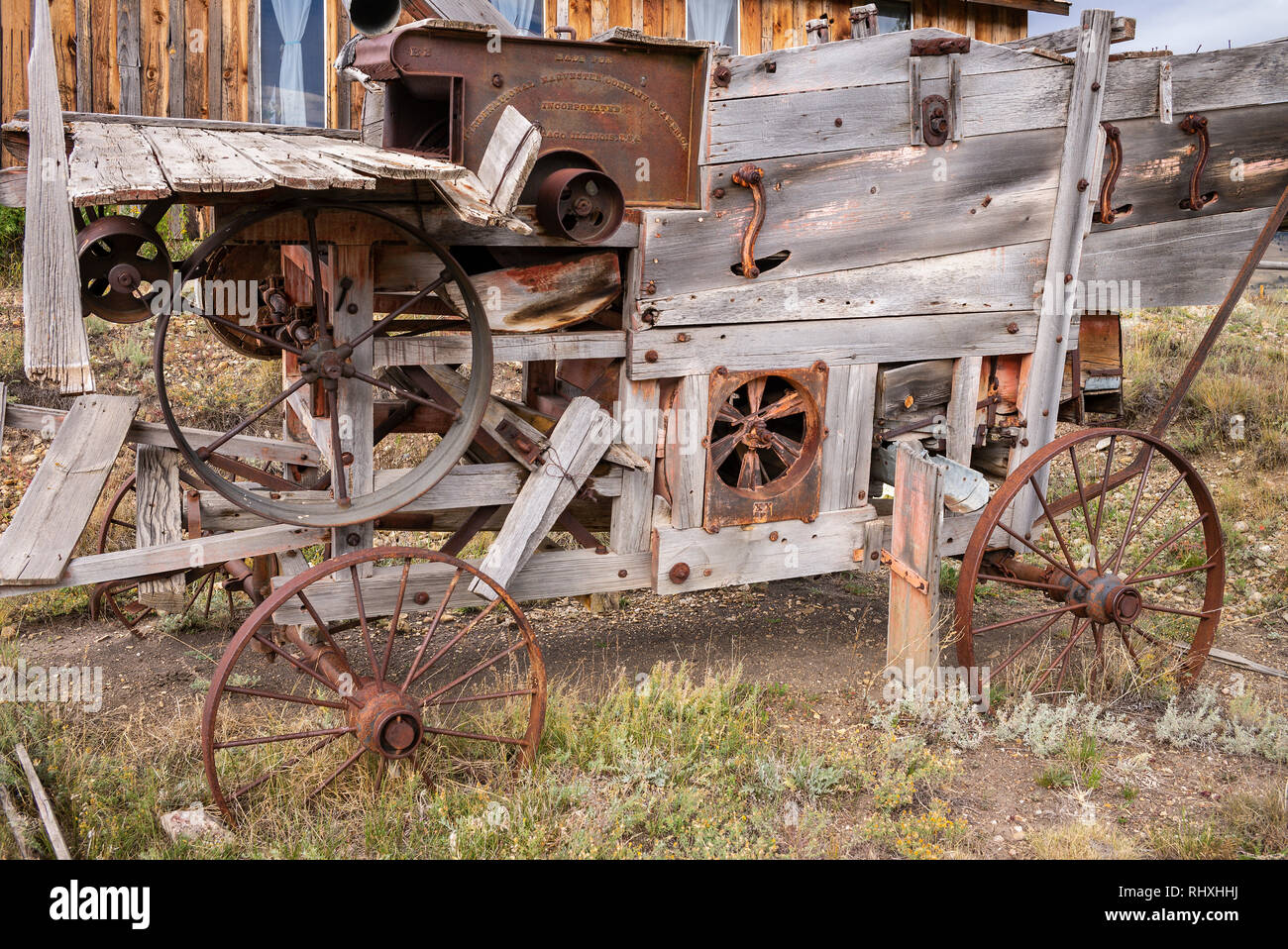 An old wooden farm harvester machine in Elizabethtown, New Mexico, USA ...