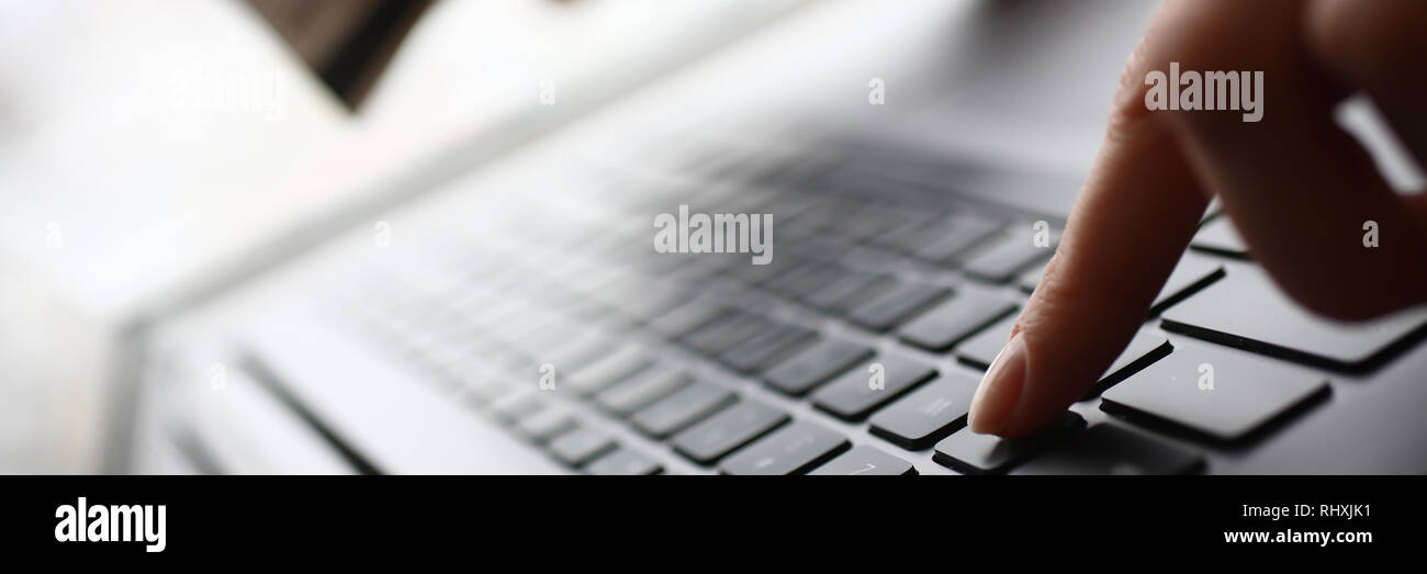 Male arms hold credit card press buttons Stock Photo - Alamy