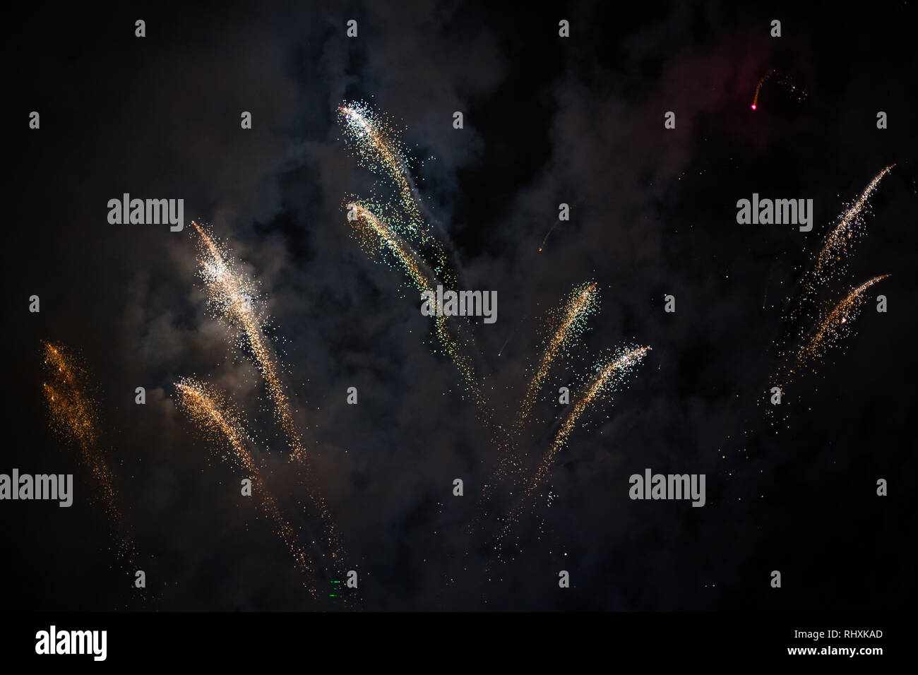 Explosive and colorful holiday fireworks at night sky. Celebration City ...