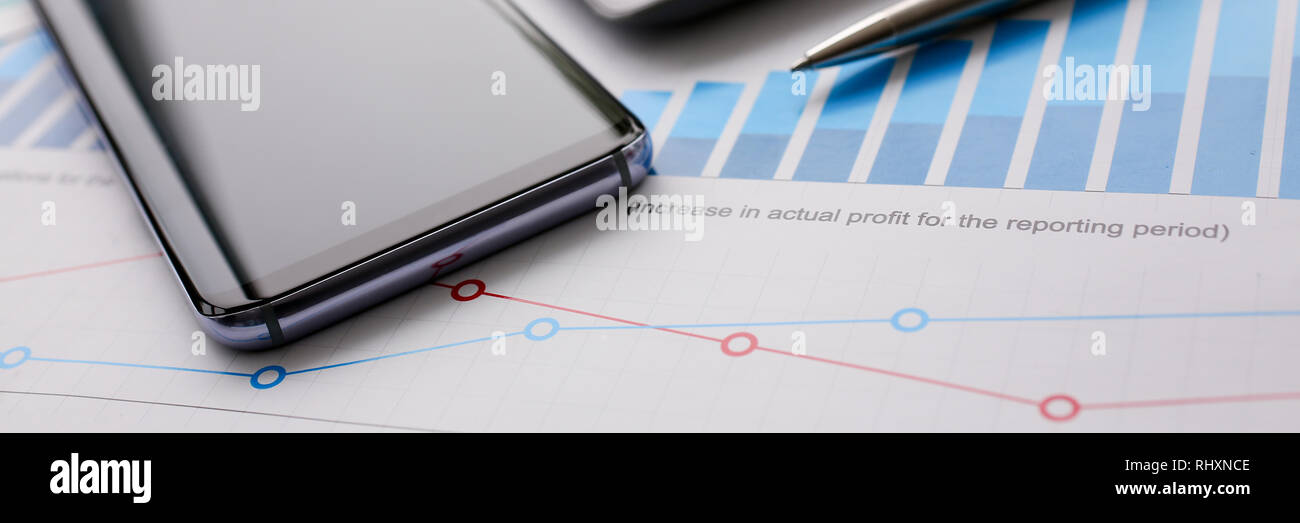 Silver calculator with gray keyboard is lying Stock Photo - Alamy