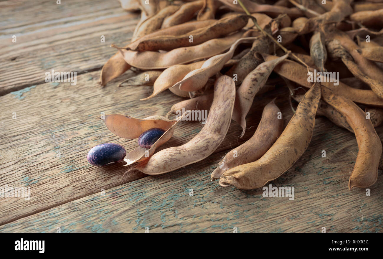 Dry bean pods, healthy organic food. Old wooden background Stock Photo ...