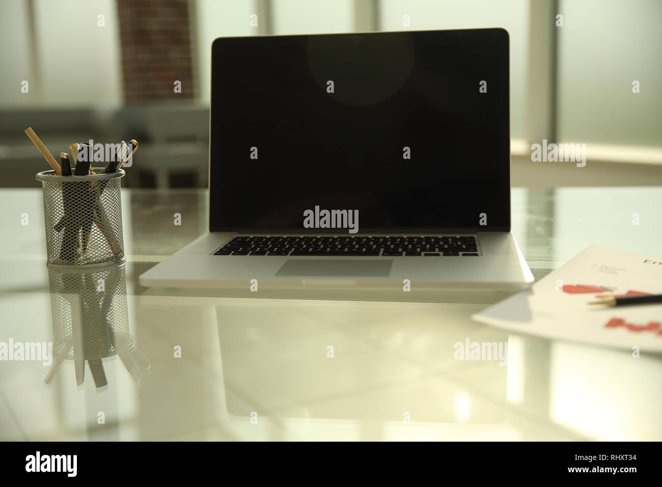 open laptop on glass table. photo with copy space Stock Photo - Alamy