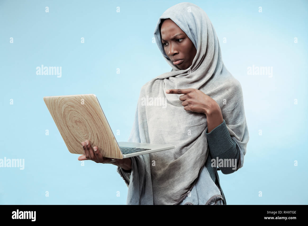 Portrait Of Female University Student Working on laptop. The beautiful ...
