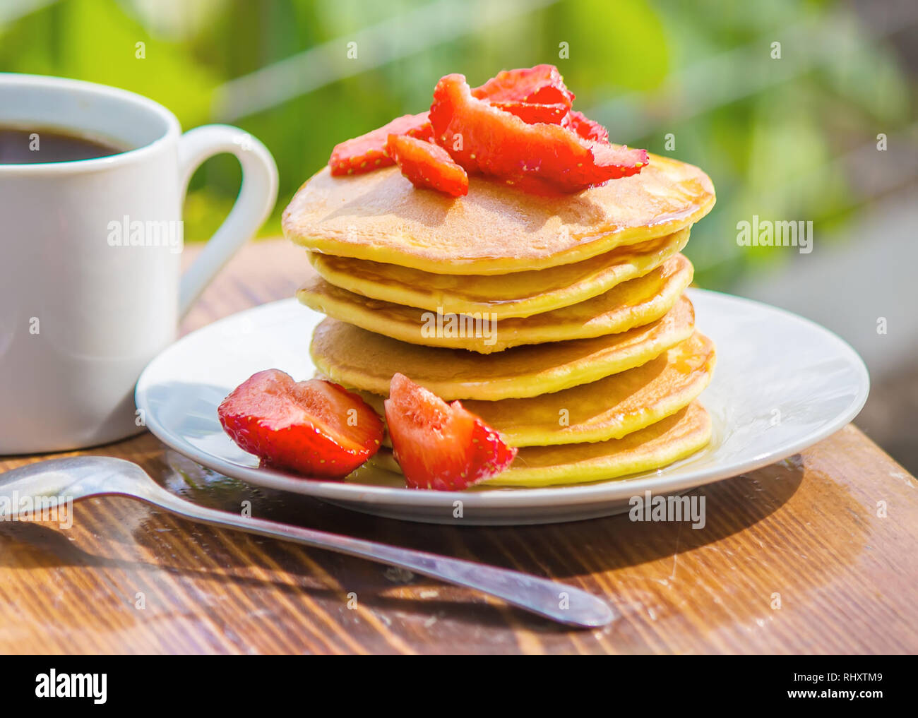 Pancakes tea and strawberry jam for breakfast Stock Photo - Alamy