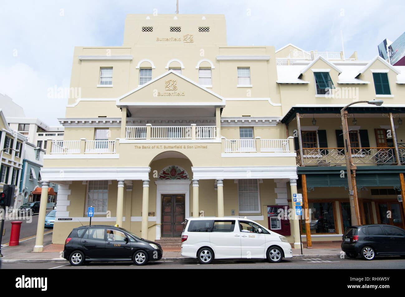 Hamilton, Bermuda - March, 20, 2016: urban bank building. Cars parked ...