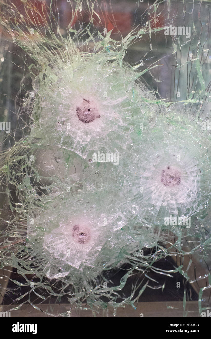 Bulletproof glass after gunshot, close up. Bulletproof glass destroyed ...