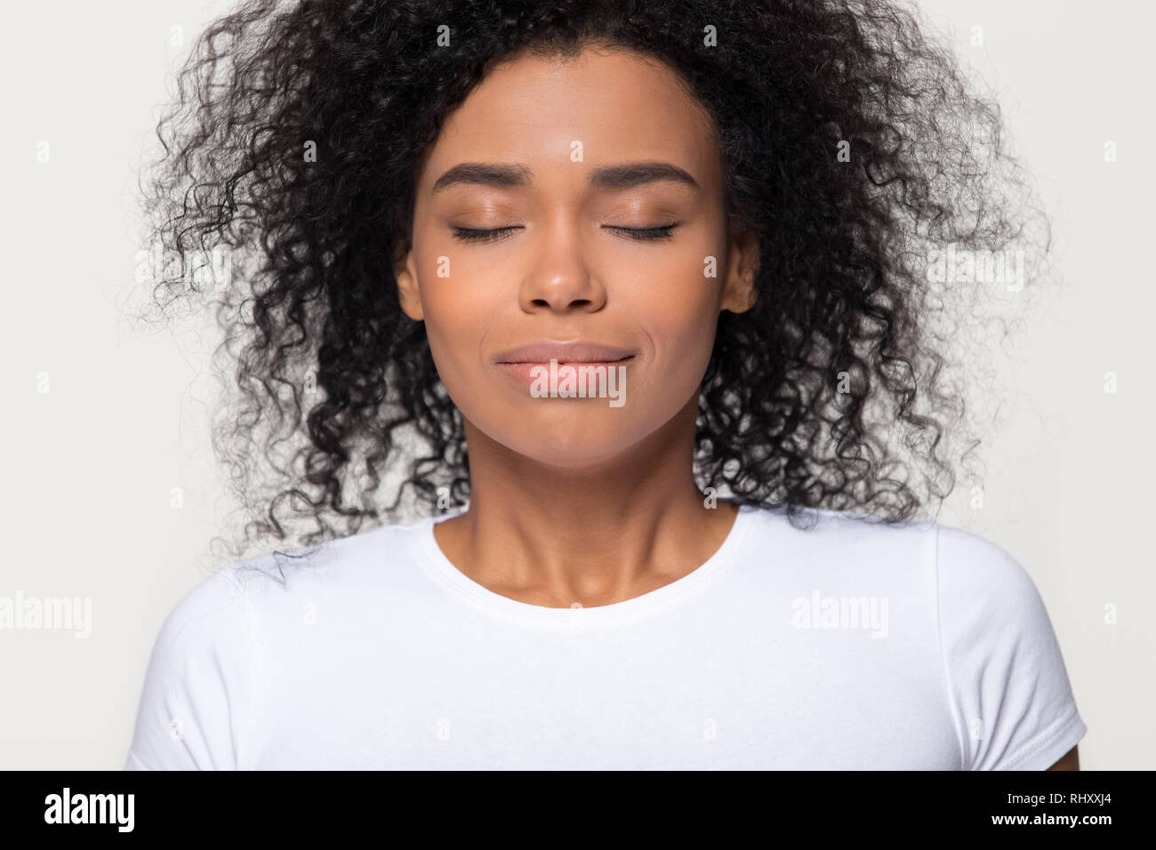 Happy calm african woman taking deep breath of fresh air Stock Photo ...