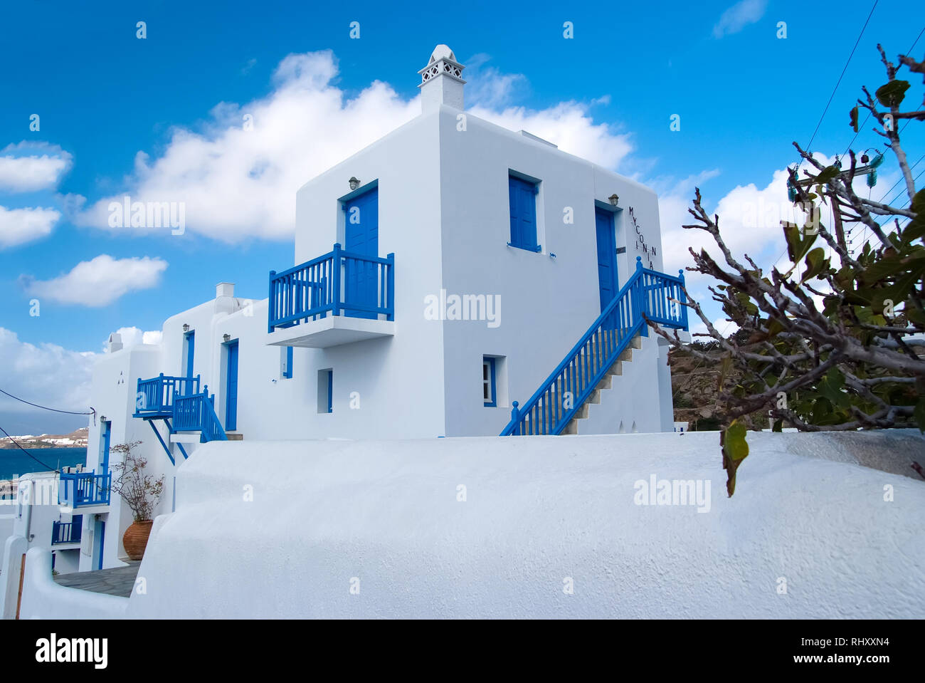 Houses in Mykonos, Greece. Whitewashed buildings with blue painted ...