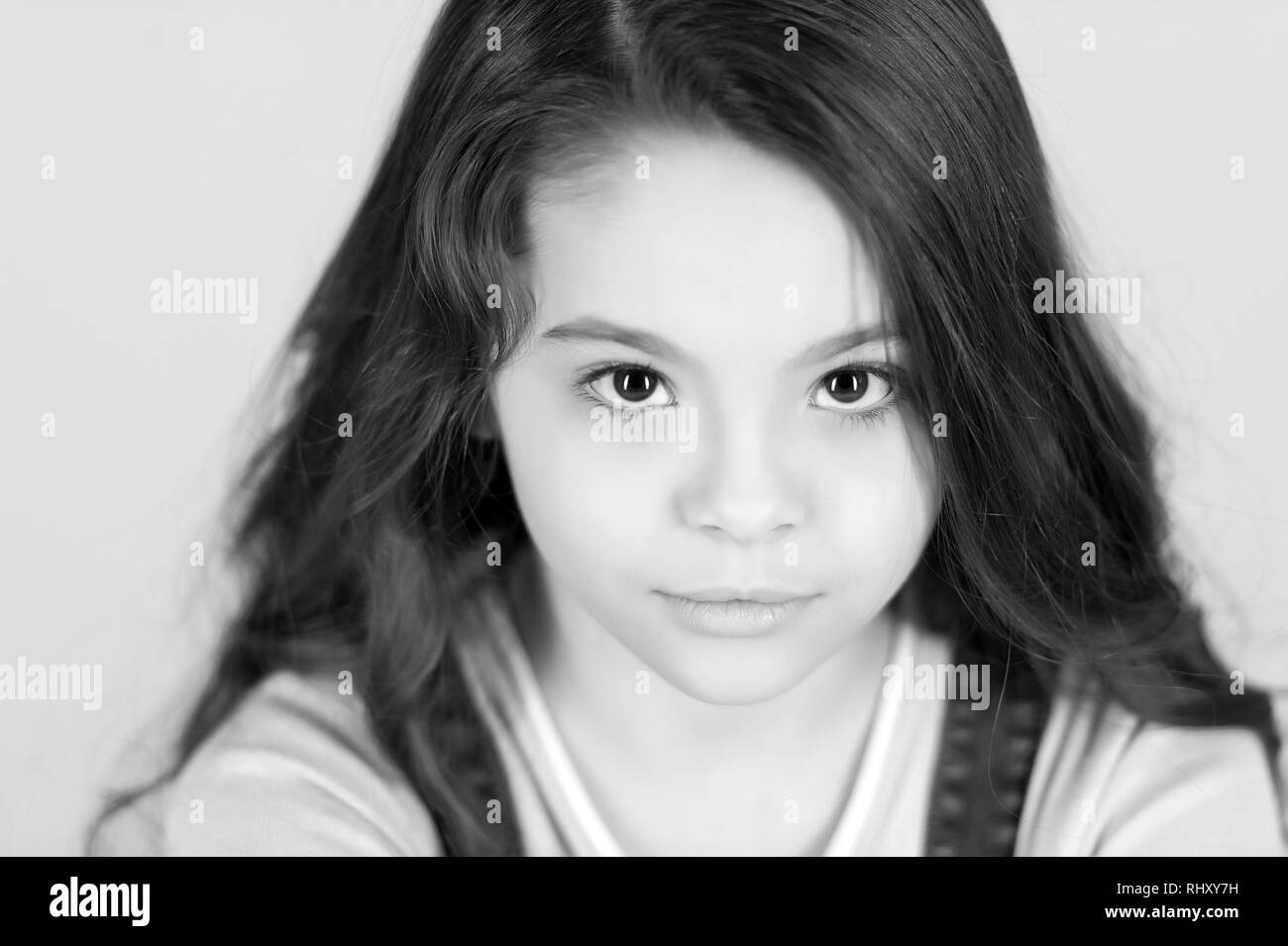 Kid model with long healthy brunette hair. Girl with adorable face on ...