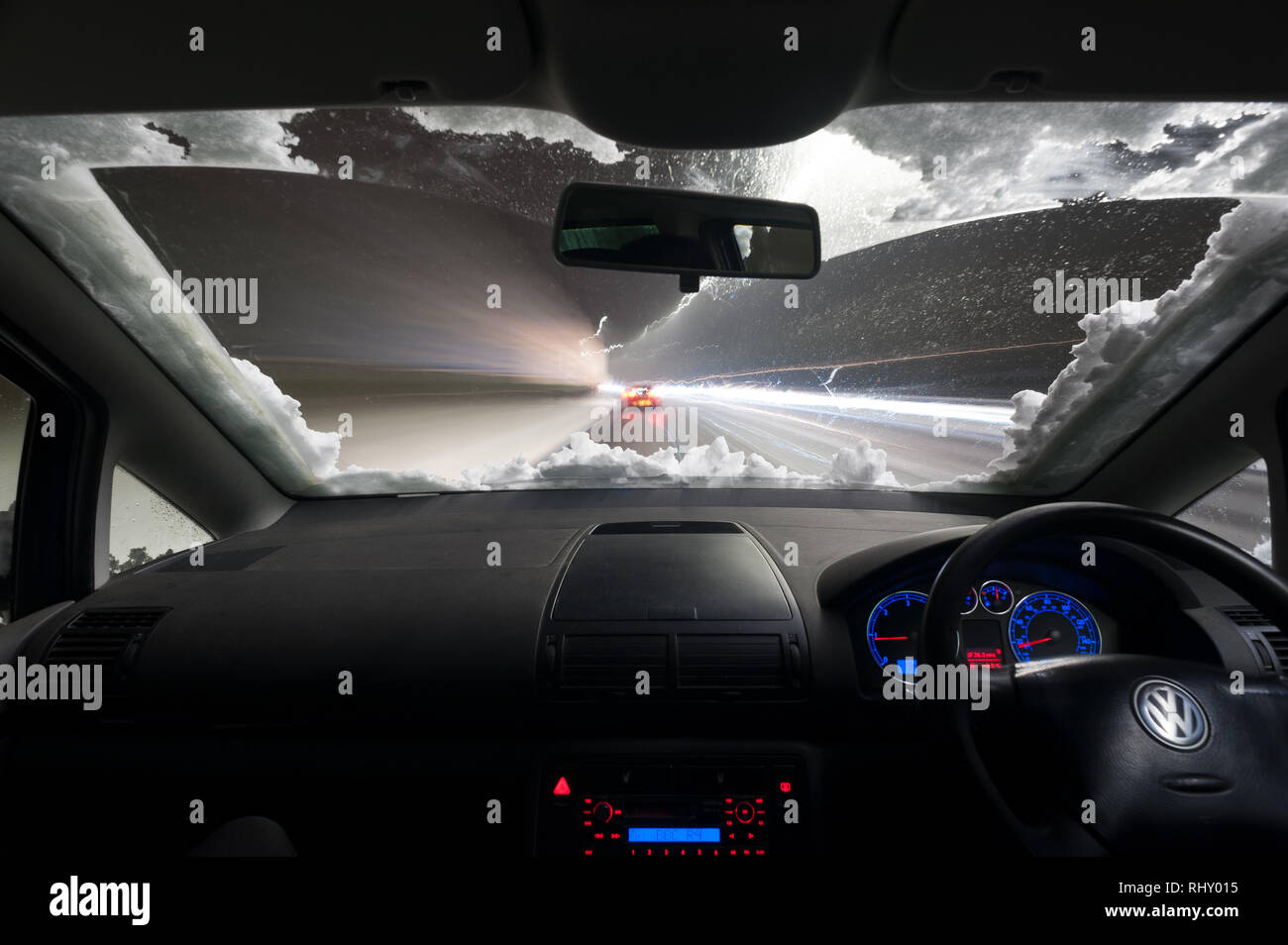 Driving into falling snow, with heavy snow buildup around perimeter of ...