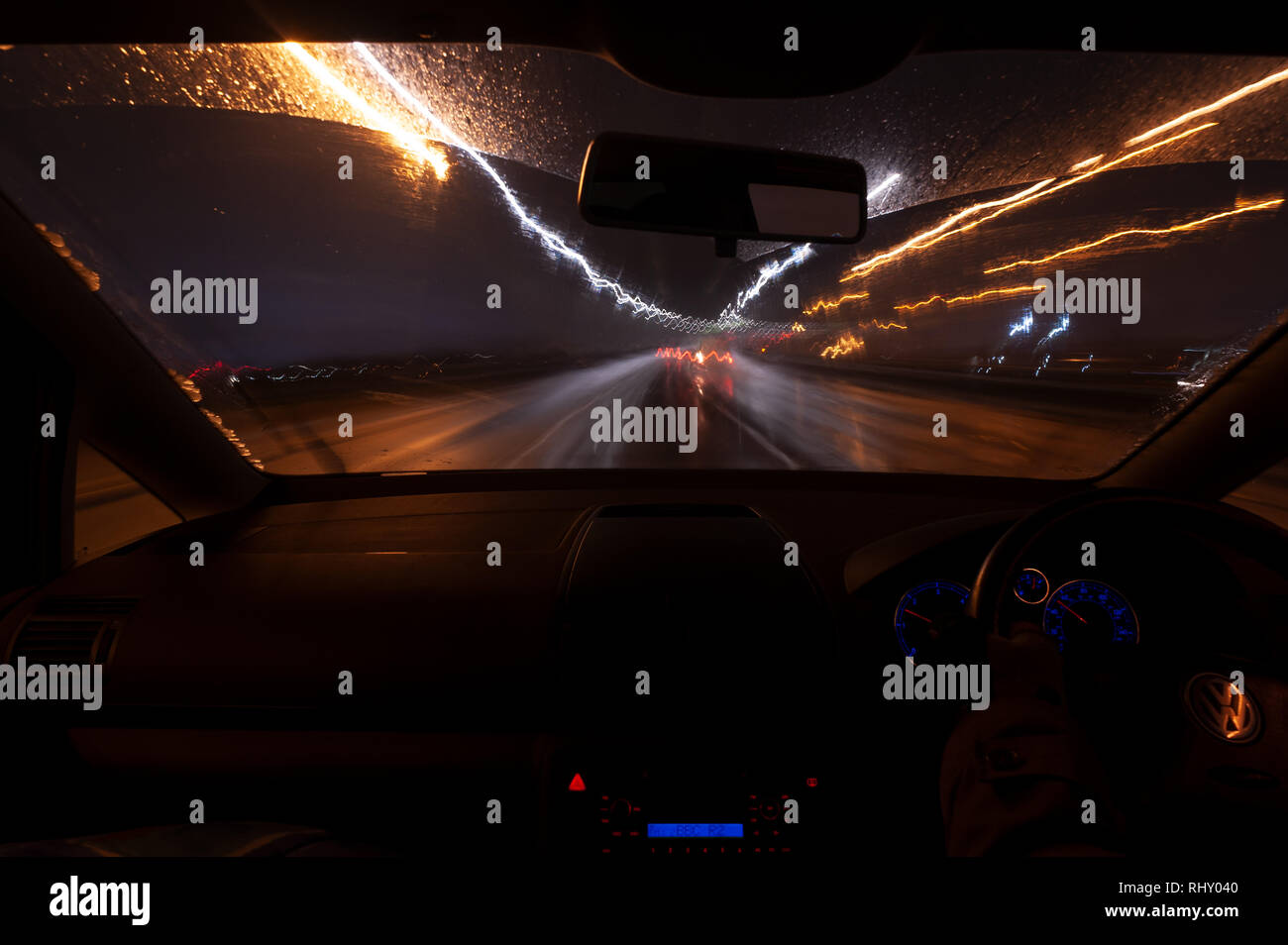 Misty and foggy conditions at night with snow flurry in British winter ...