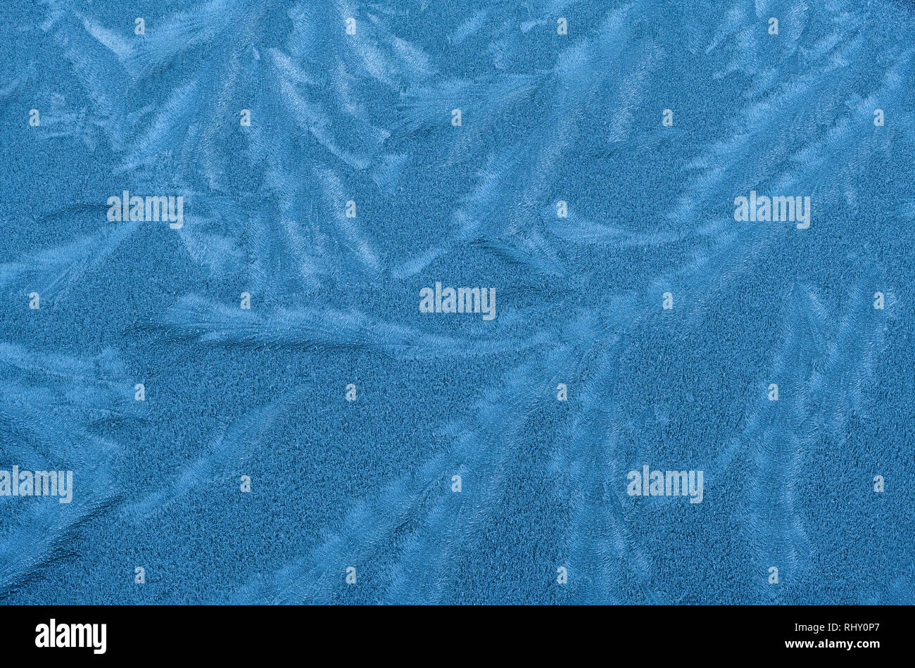 Patterns in ice on a frosty car windscreen Stock Photo - Alamy