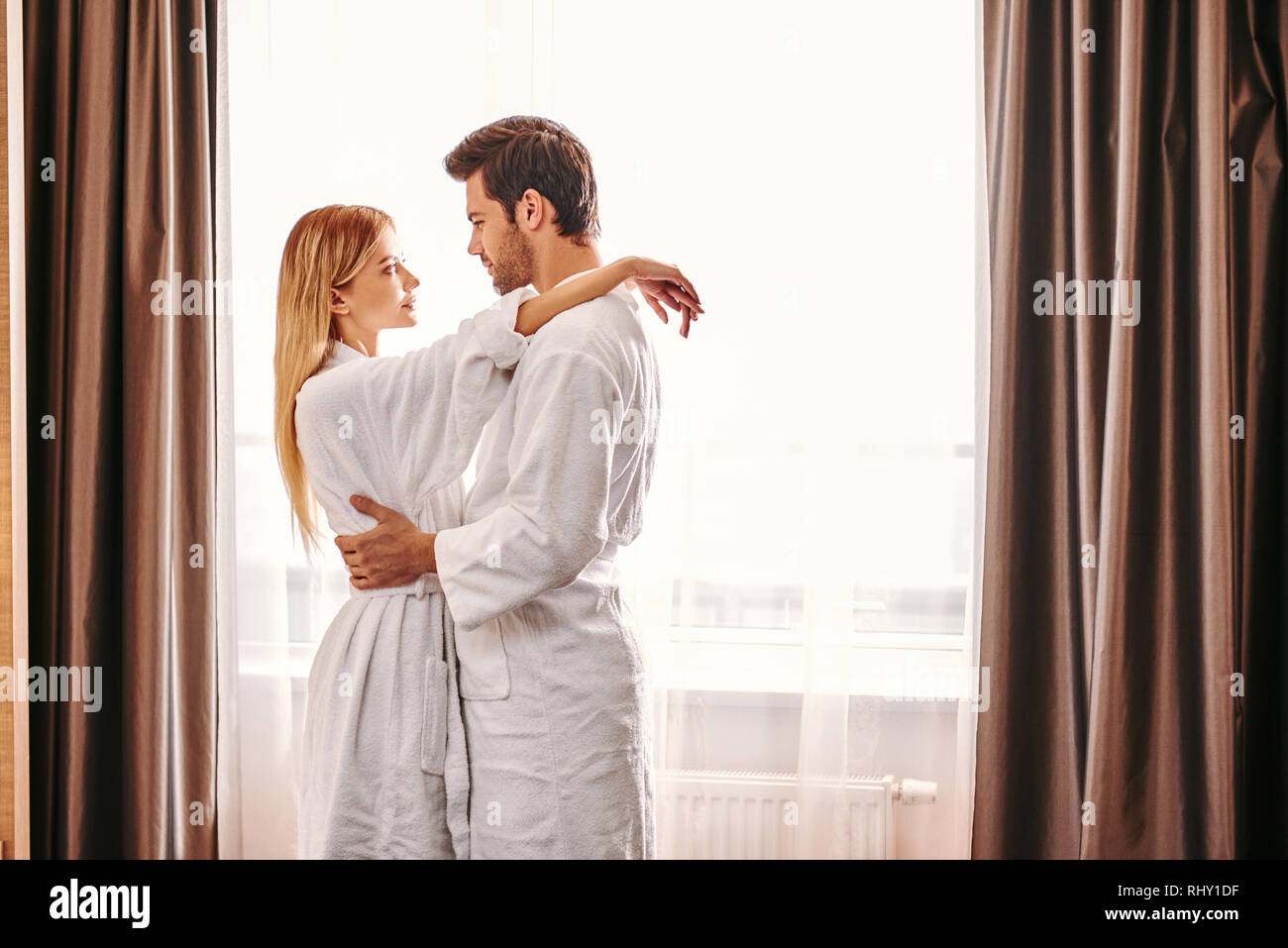 Total love. Young couple travel together hotel room leisure. Young ...