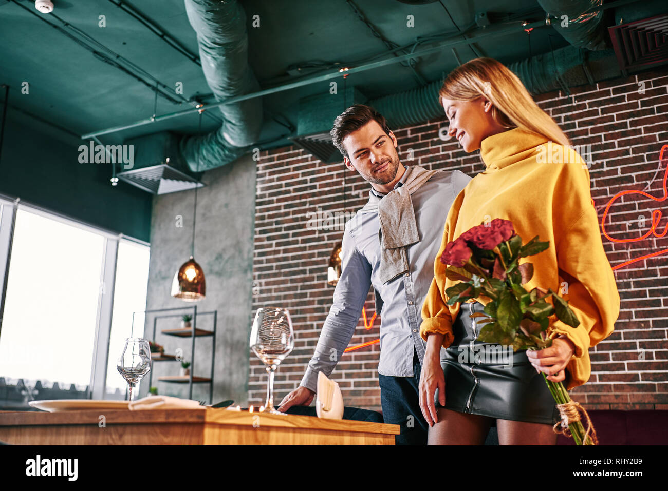 Secret ingredient is love. Couple are going to sit at a table near ...