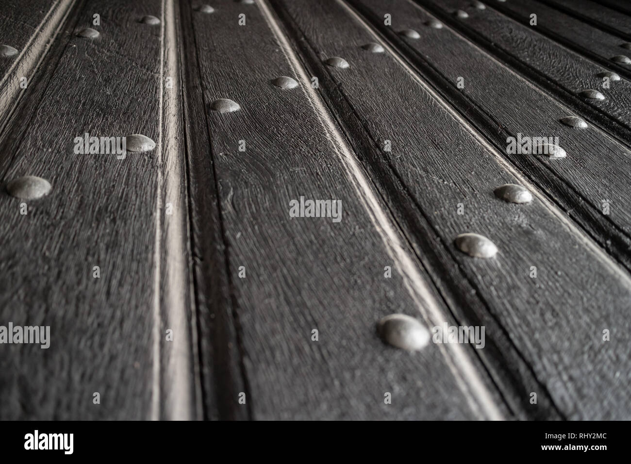 Texture of old wooden plank gate door with iron rivets Stock Photo - Alamy