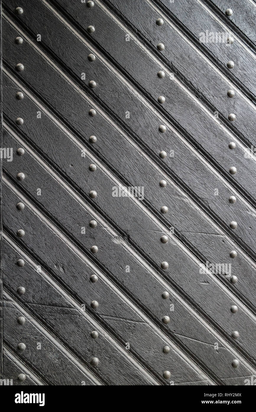 Texture of old wooden plank gate door with iron rivets Stock Photo - Alamy