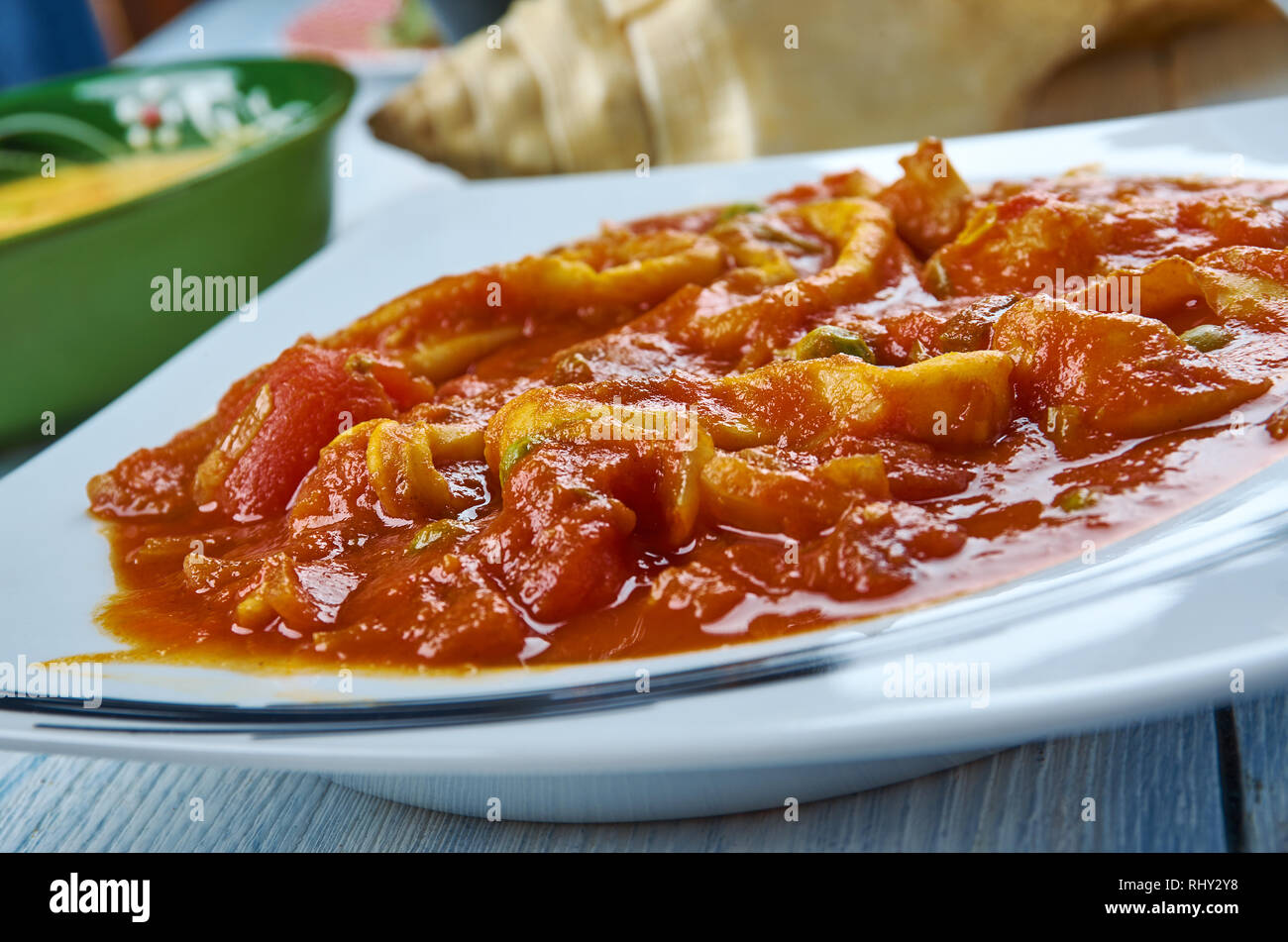 Koonthal Kulambu, Squid in Roasted coconut gravy is cooked , Kerala ...