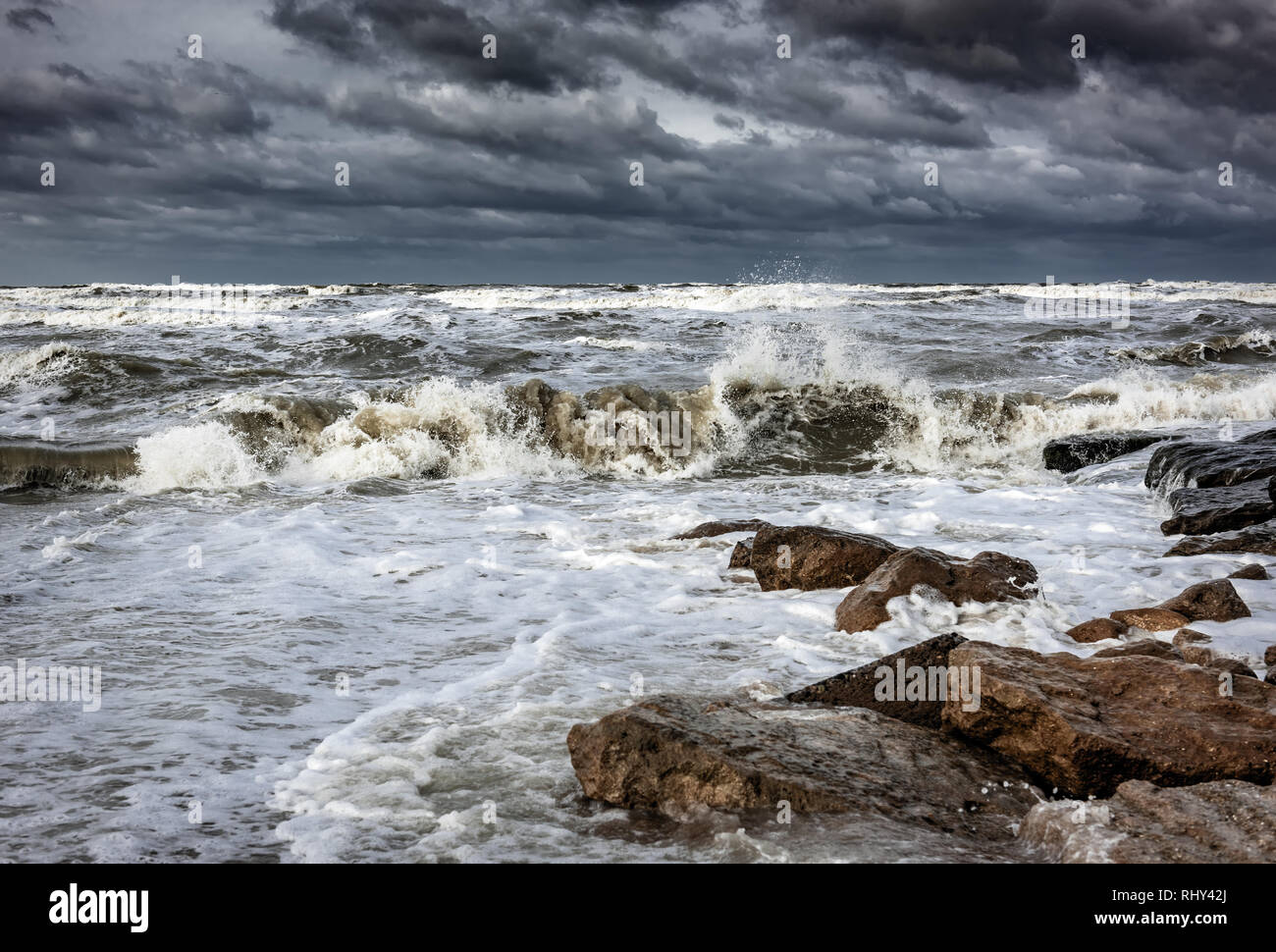 Stormy sea, the waves break on the rocks Stock Photo - Alamy
