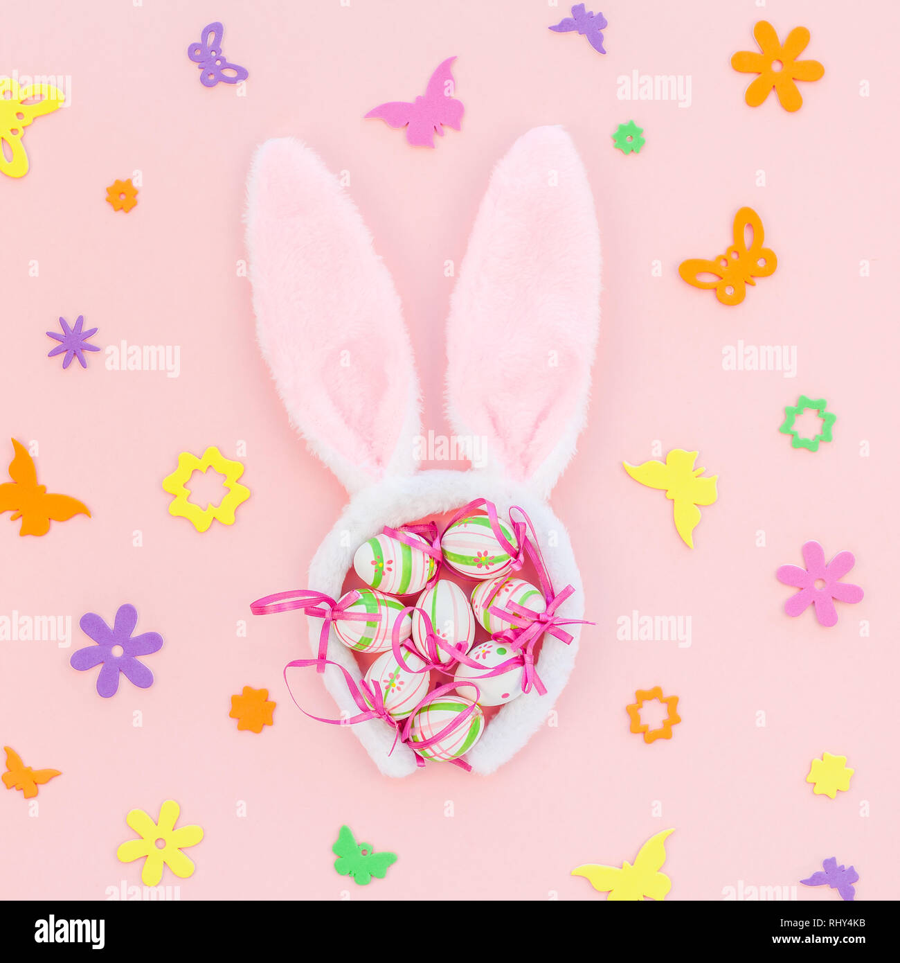 Creative Top view flat lay holiday composition Easter eggs bunny ears ...