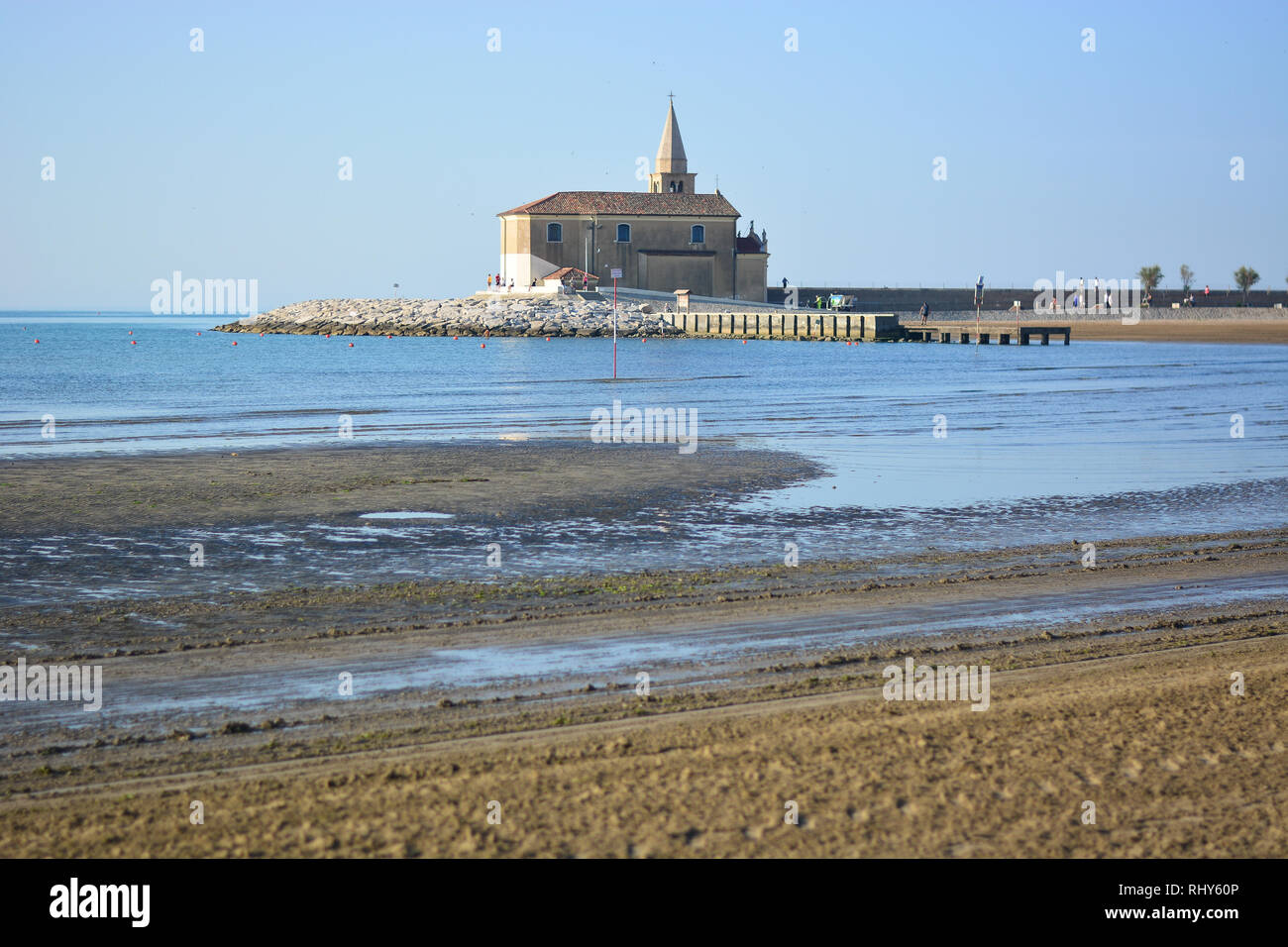 the Caorle beach with the sailors' church in the background Stock Photo ...