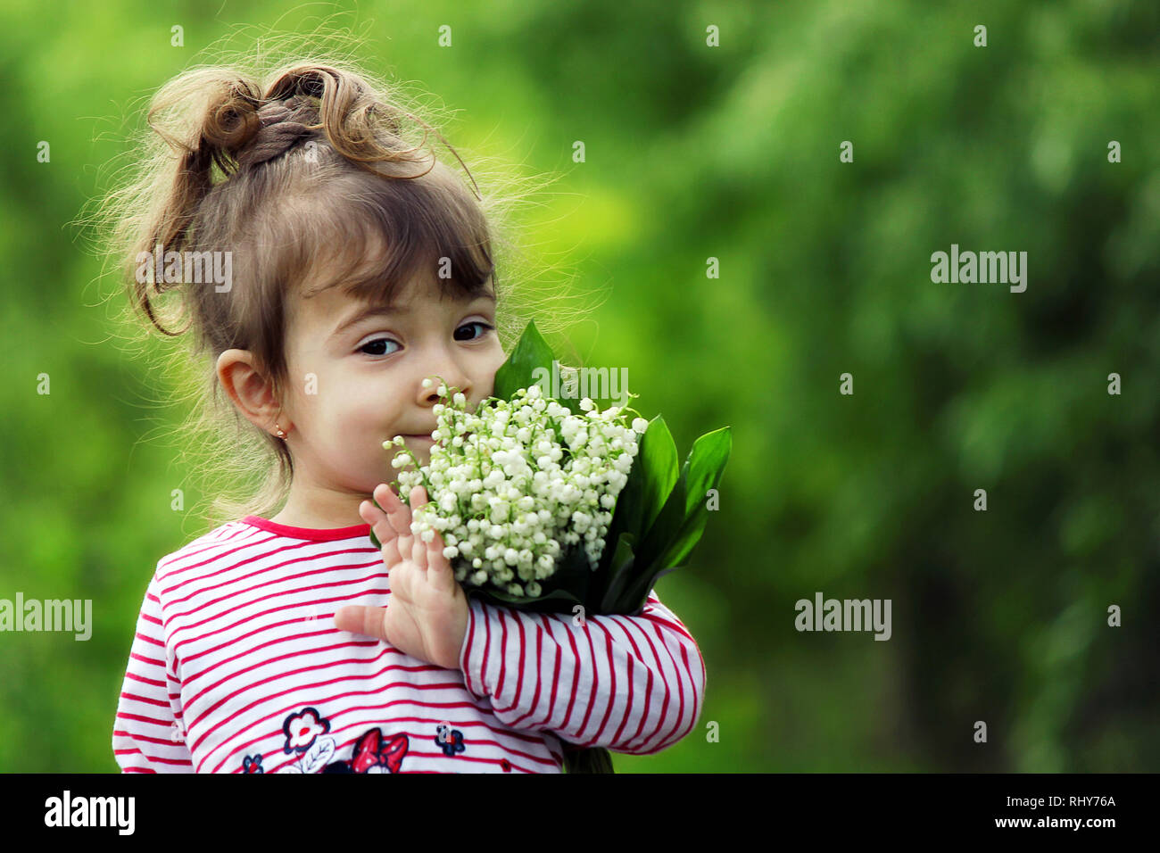 Girl with flowers in the spring outside. Selective focus Stock Photo ...