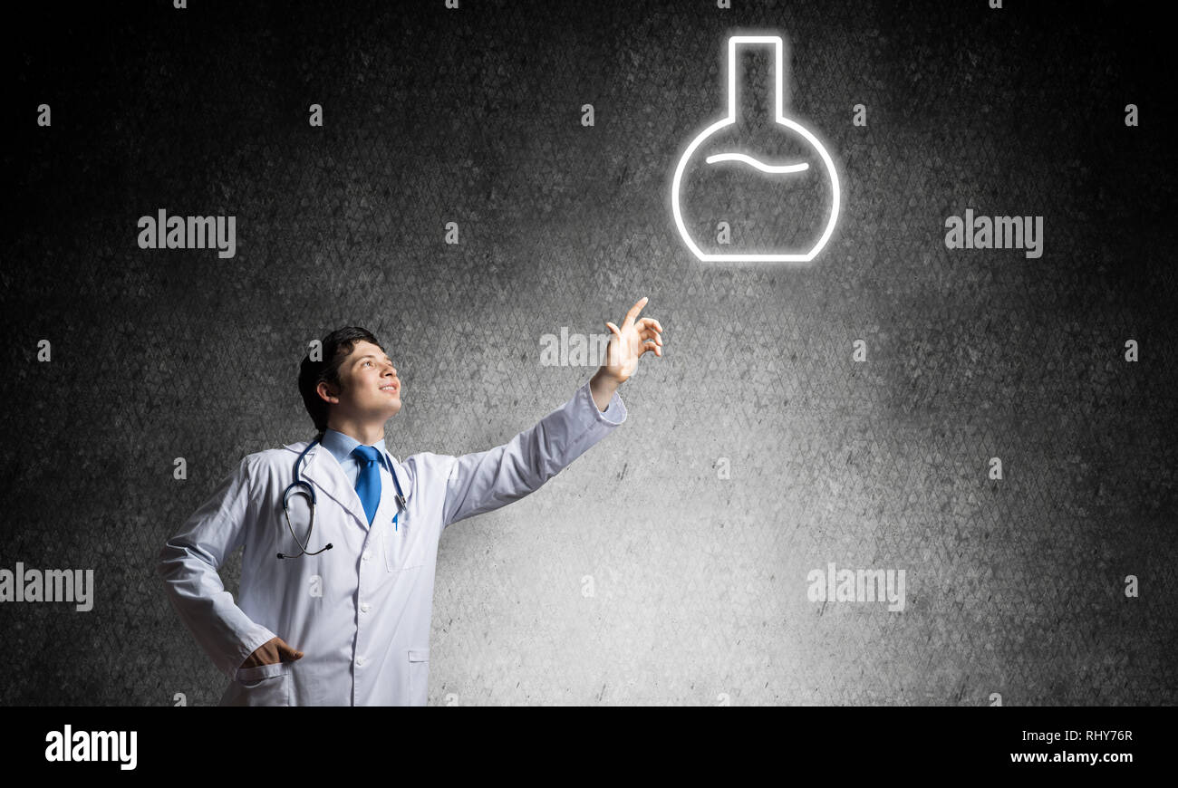 Doctor and vial symbol Stock Photo - Alamy