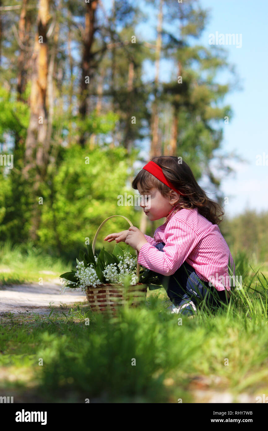 Girl with flowers in the spring outside. Selective focus Stock Photo ...