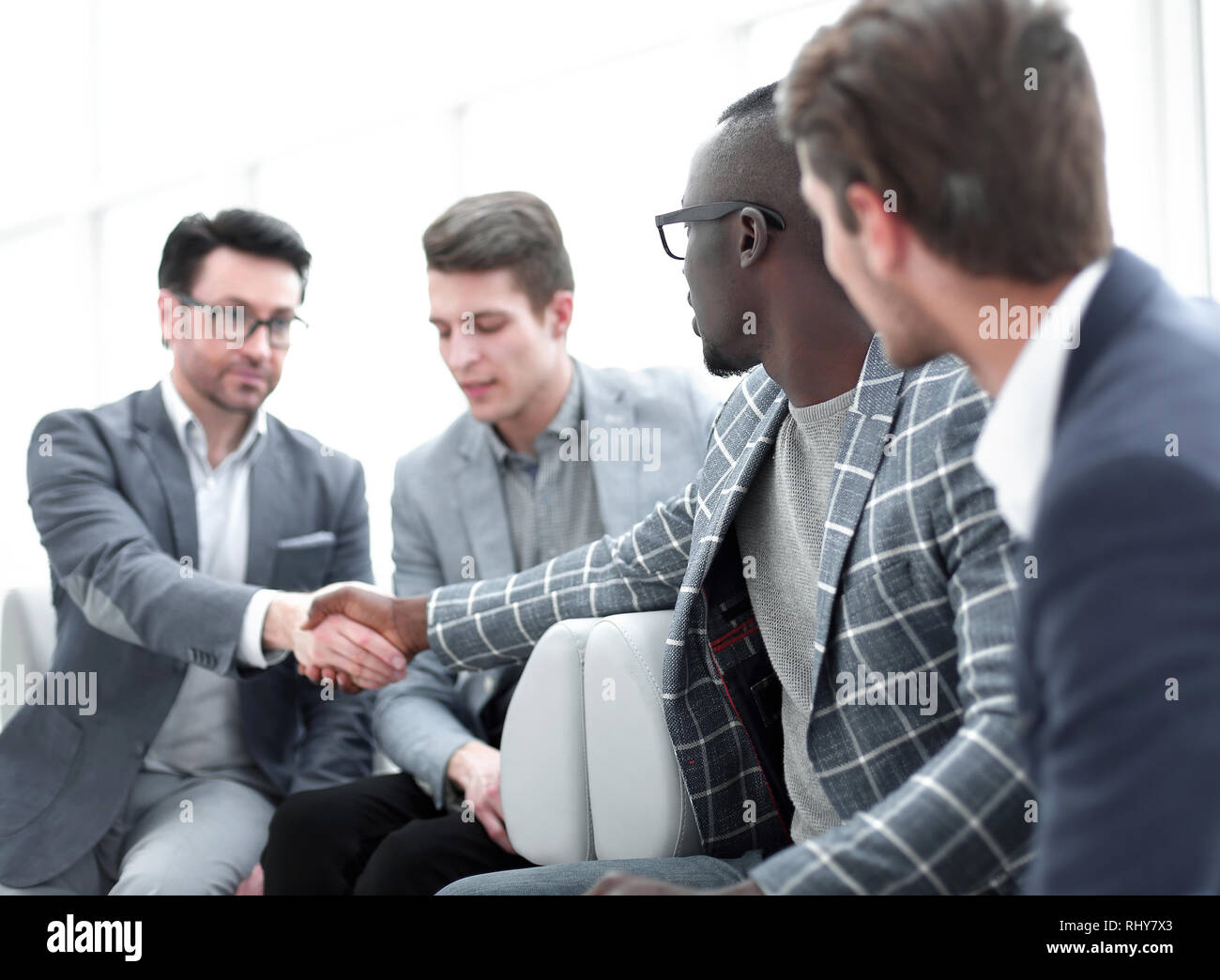 business colleagues reaching out for a handshake Stock Photo - Alamy