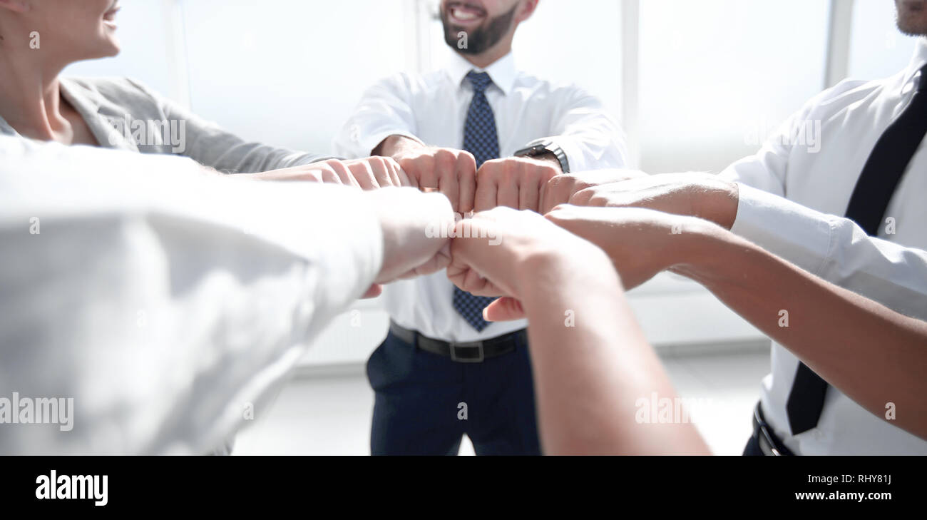 close up.a group of business people showing their unity Stock Photo - Alamy