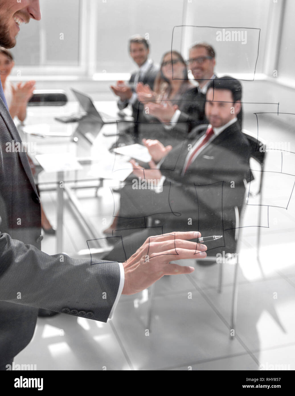 businessman drawing a marketing diagram on a glass Board Stock Photo ...