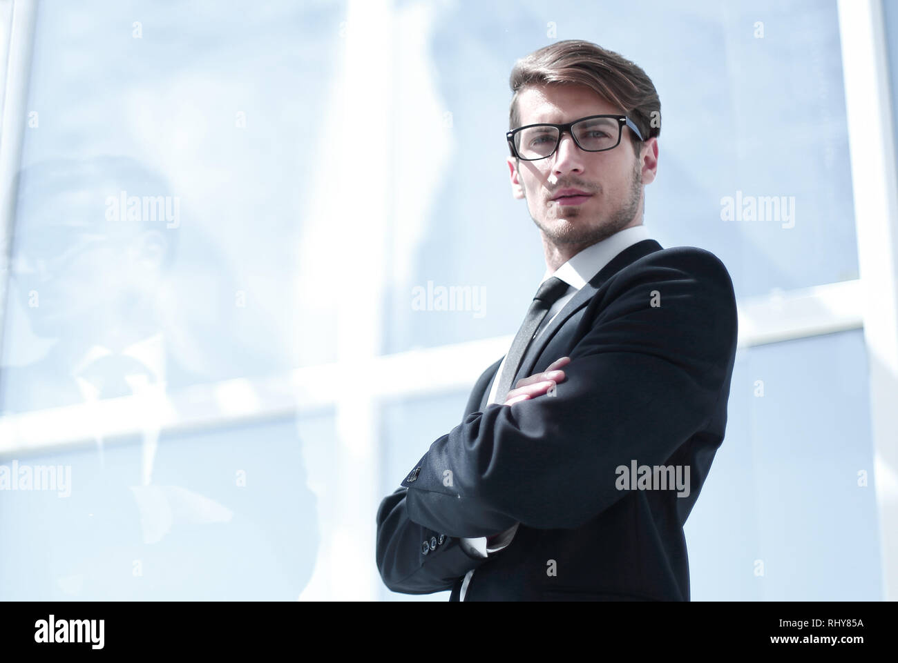 confident businessman looking at you Stock Photo - Alamy