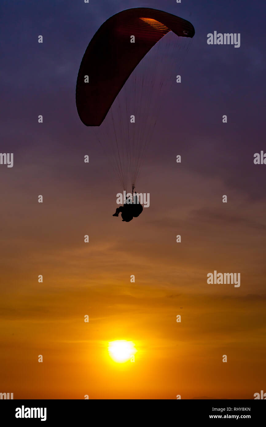 Parasuit ride in the sunset at Lima,Peru Stock Photo - Alamy