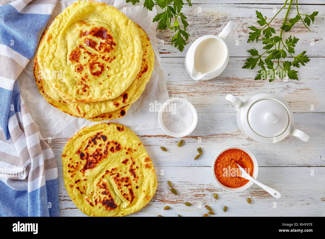 naan - delicious hot freshly baked homemade indian flatbread on a white ...